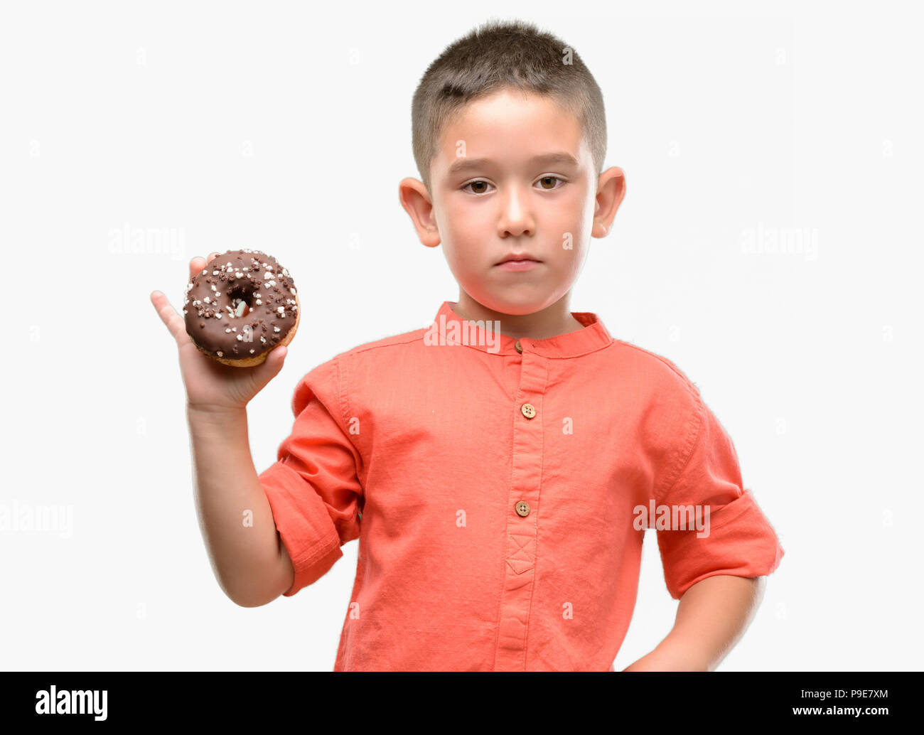 Boy eating a doughnut hi-res stock photography and images - Alamy