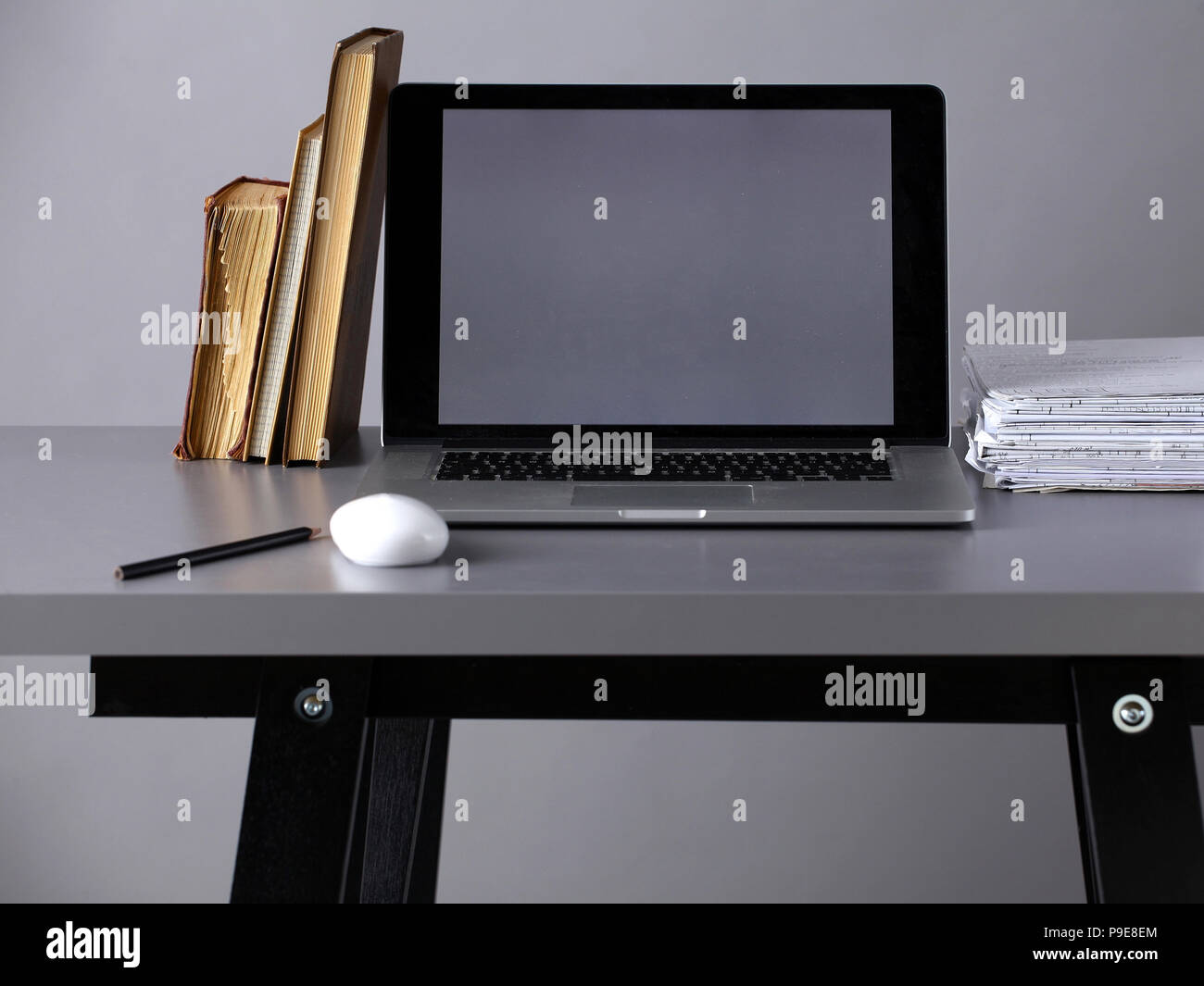 Workspace with computer and stack of papers in office Stock Photo - Alamy