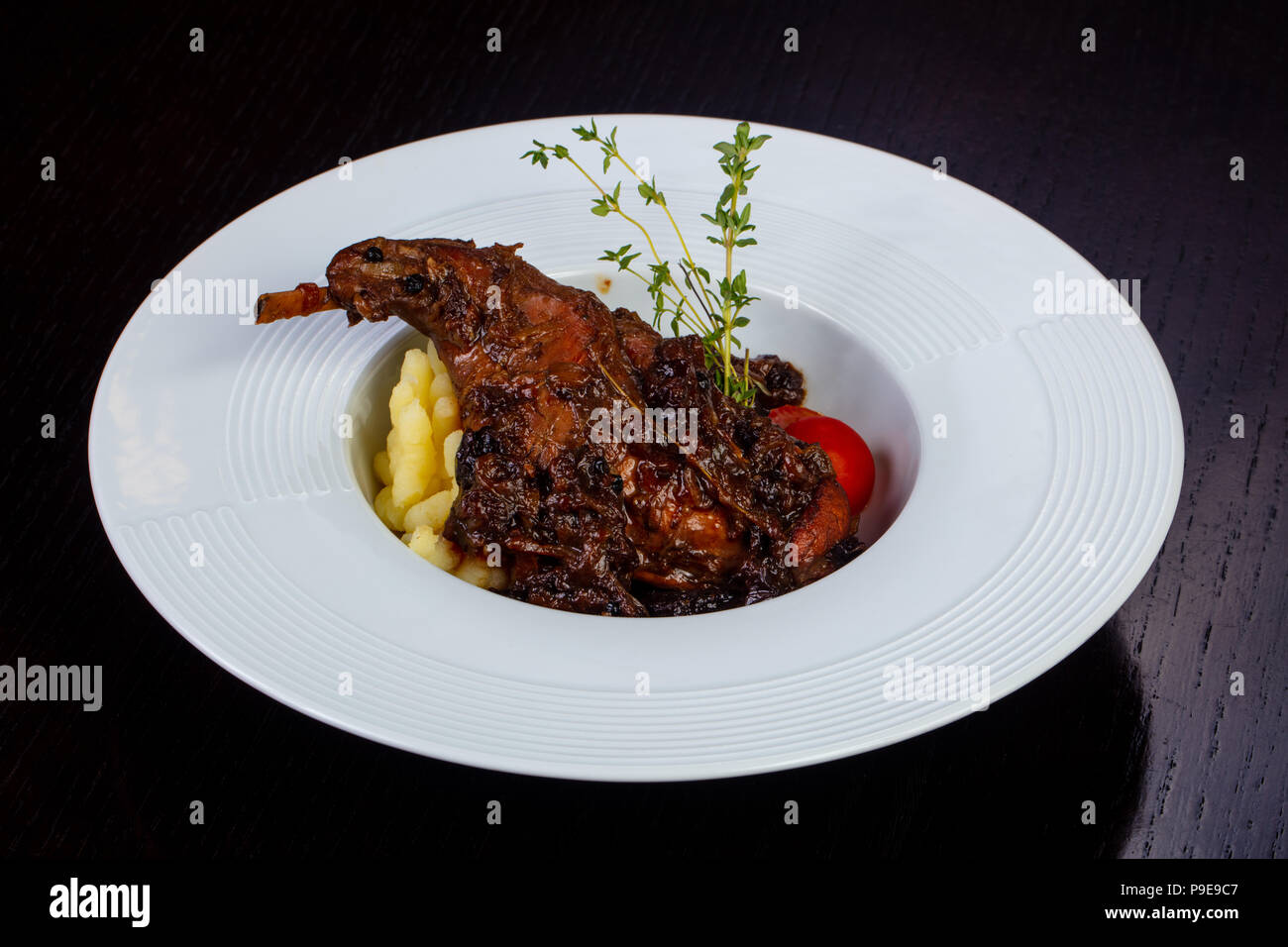 Delicious fried rabbit with prunes Stock Photo - Alamy