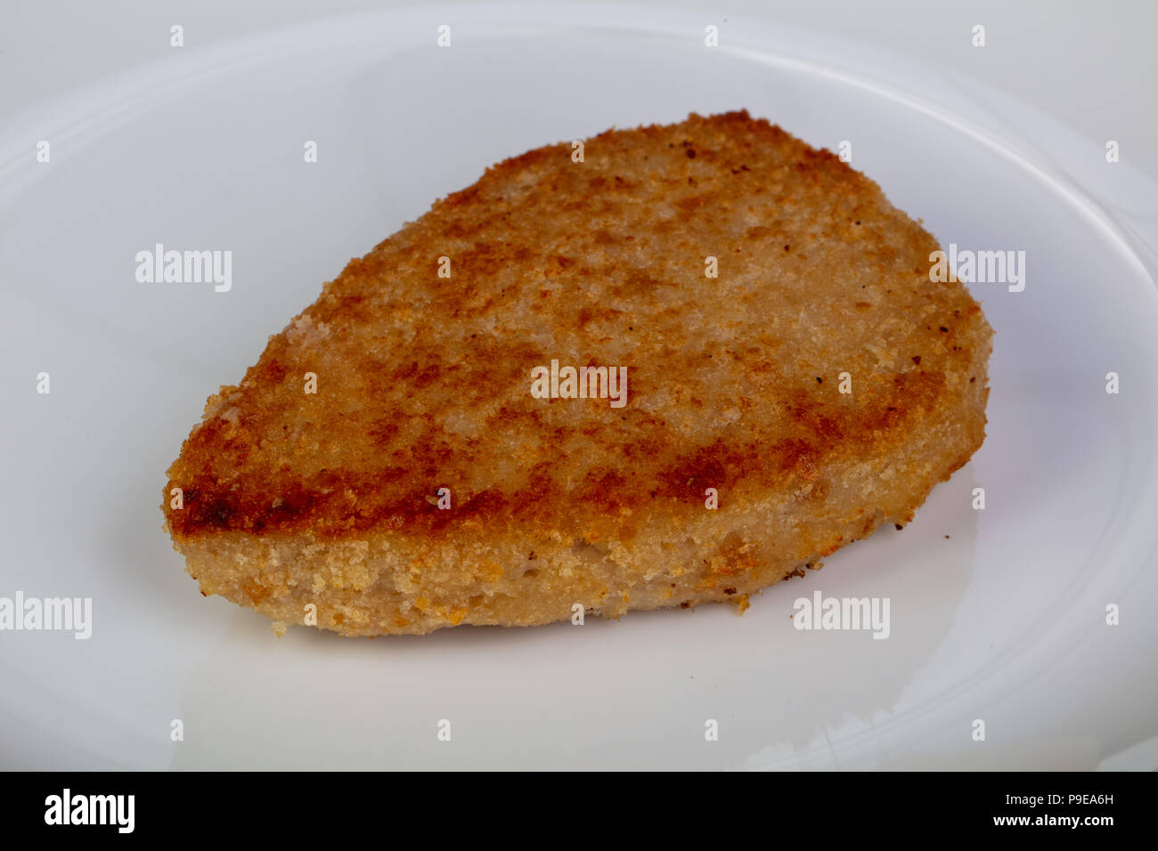 Roasted fish cutlet in the plate Stock Photo - Alamy