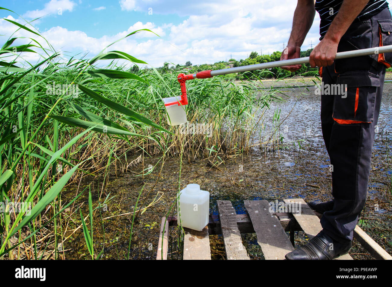 Take samples of water for laboratory testing. The concept - analysis of ...