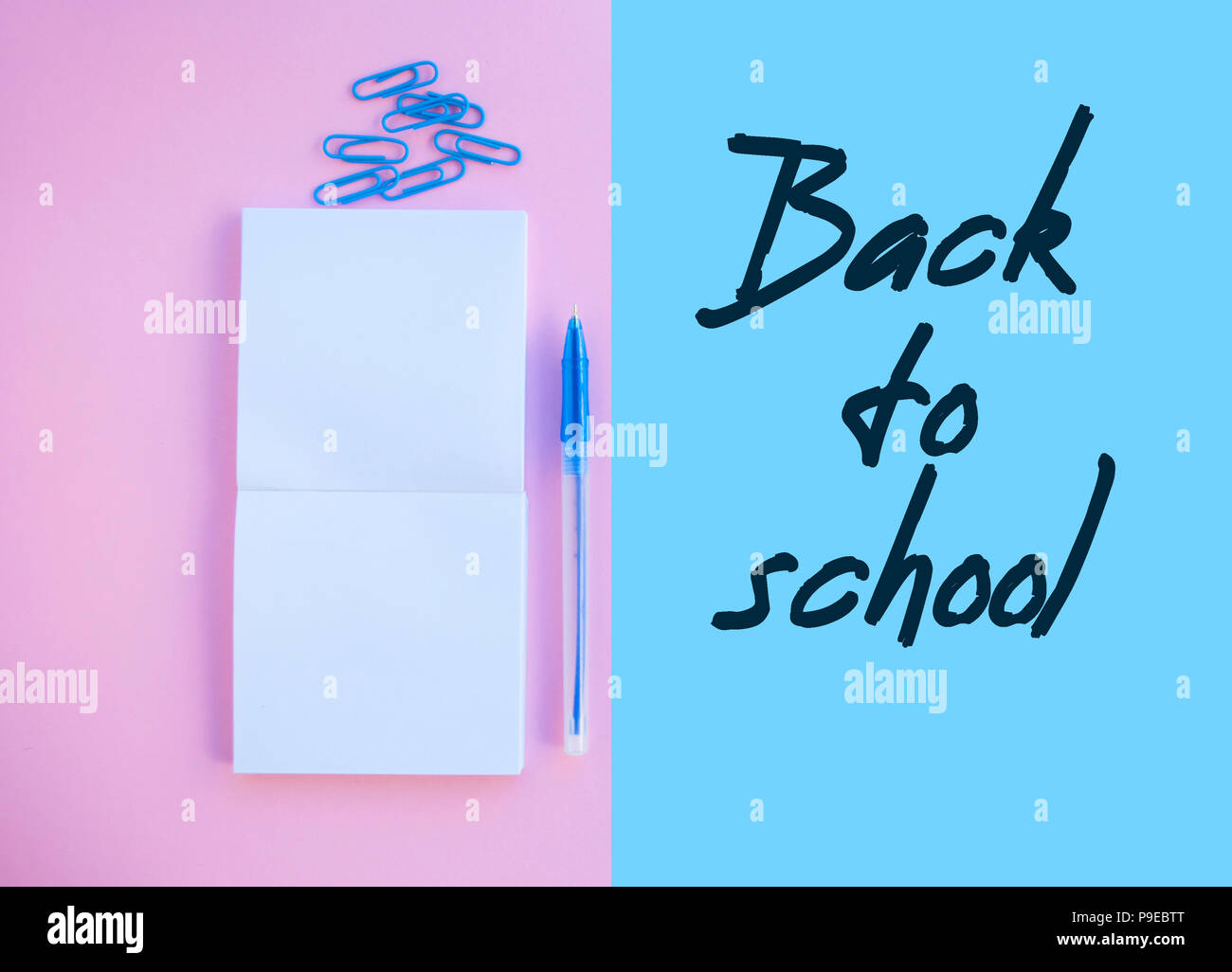 Back to school concept. School supplies on pink and blue background ...