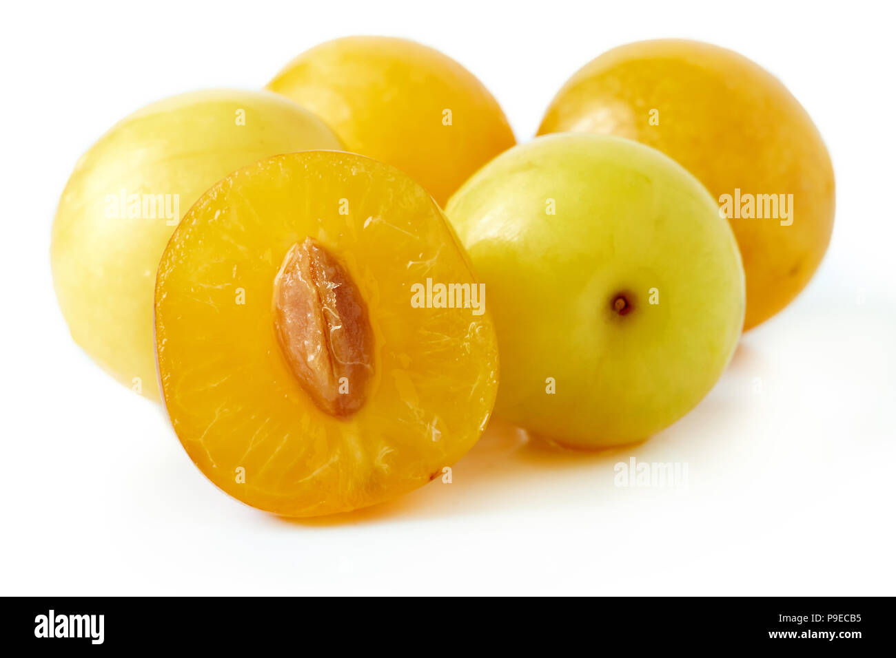 Yellow cherry plums also known as mirabelle plums isolated on white ...