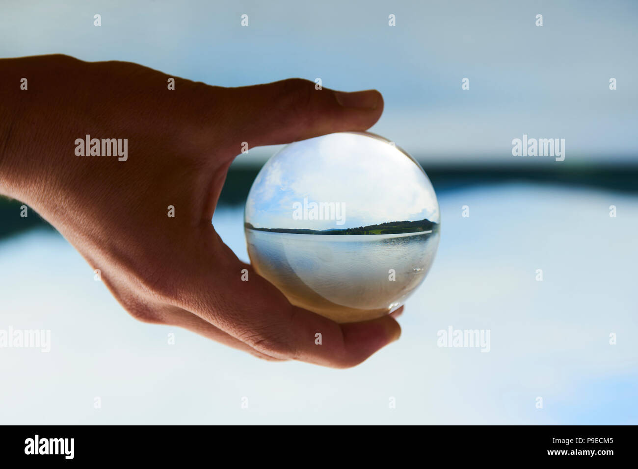 Human hand holding transparent ball hi-res stock photography and images ...
