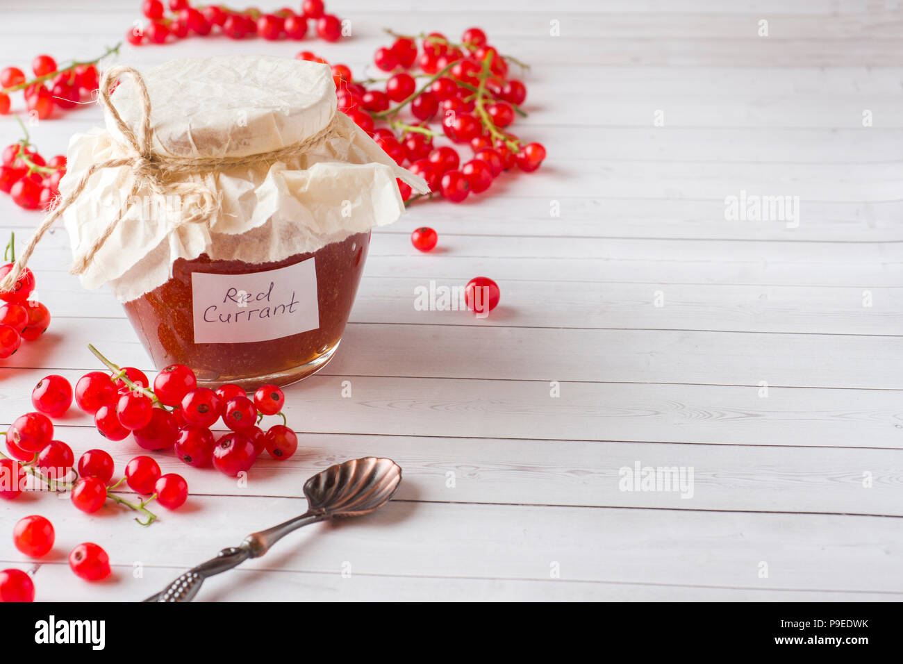 Useful currant jam in a glass jar. Fresh red currant Stock Photo - Alamy