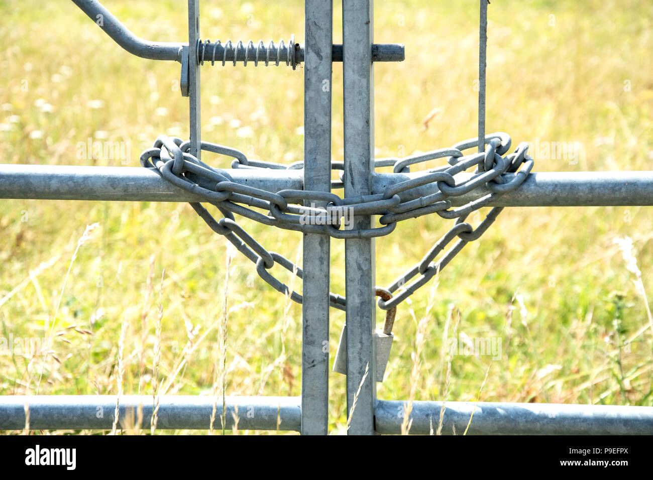 Padlock and chain around a gate hi-res stock photography and images - Alamy