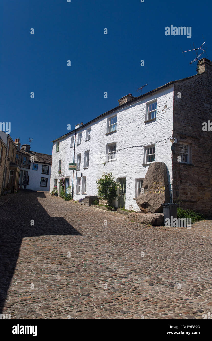 Cobbled main street of Dent village in the Yorkshire Dales National ...