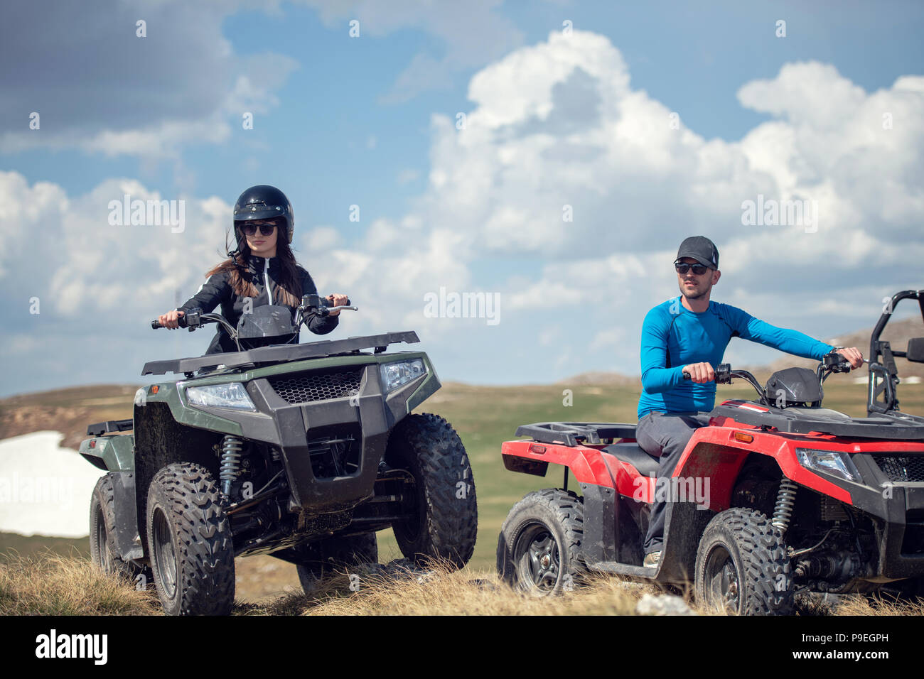 Friends driving off-road with quad bike or ATV and UTV vehicles Stock ...