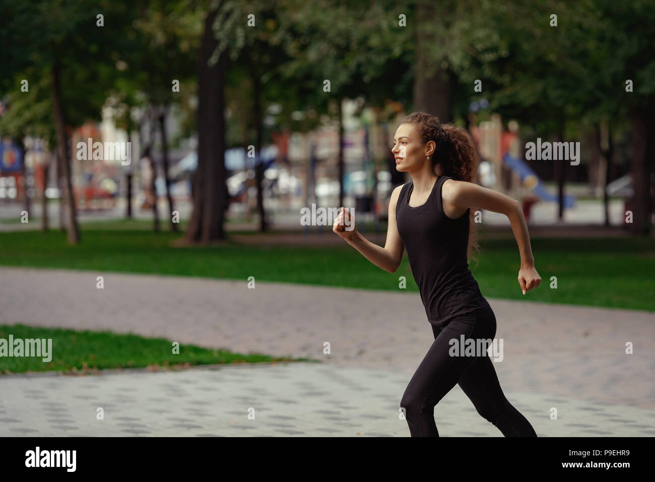 young attractive woman running Stock Photo - Alamy