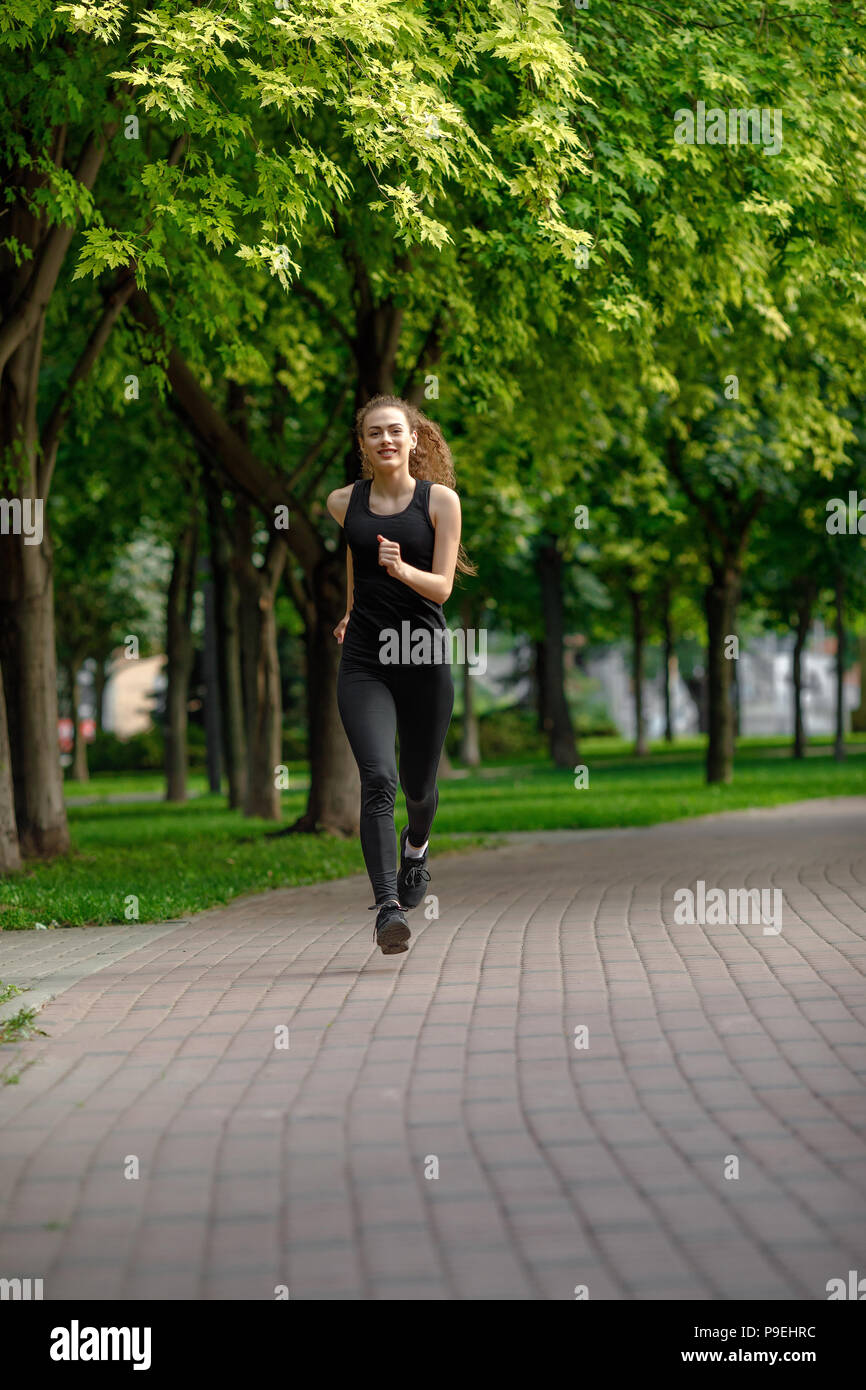 young attractive woman running Stock Photo - Alamy