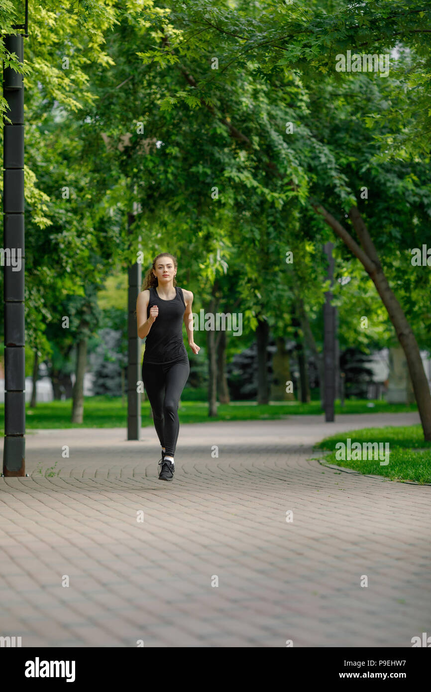 young attractive woman running Stock Photo - Alamy