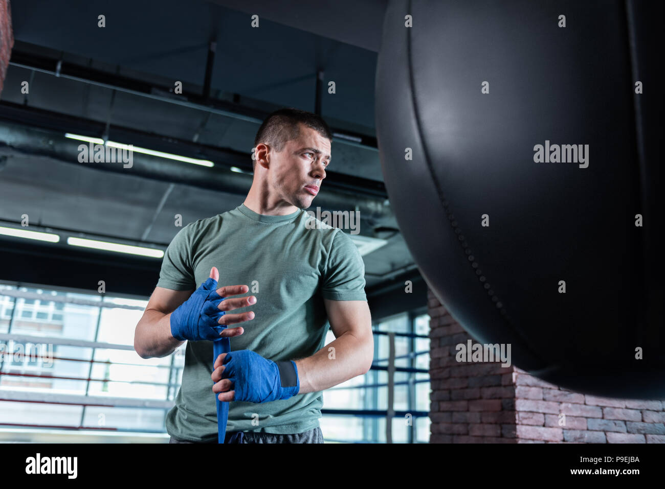 Serious strong sportsman training hard in gym Stock Photo - Alamy