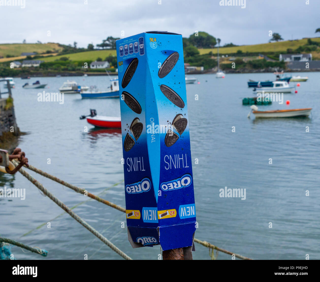 empty oreo biscuit or cookie packet or box pushed onto a metal post ...