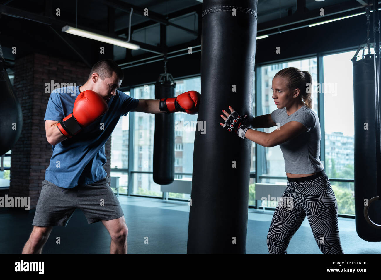 Blonde-haired wife supporting her husband working as professional boxer ...