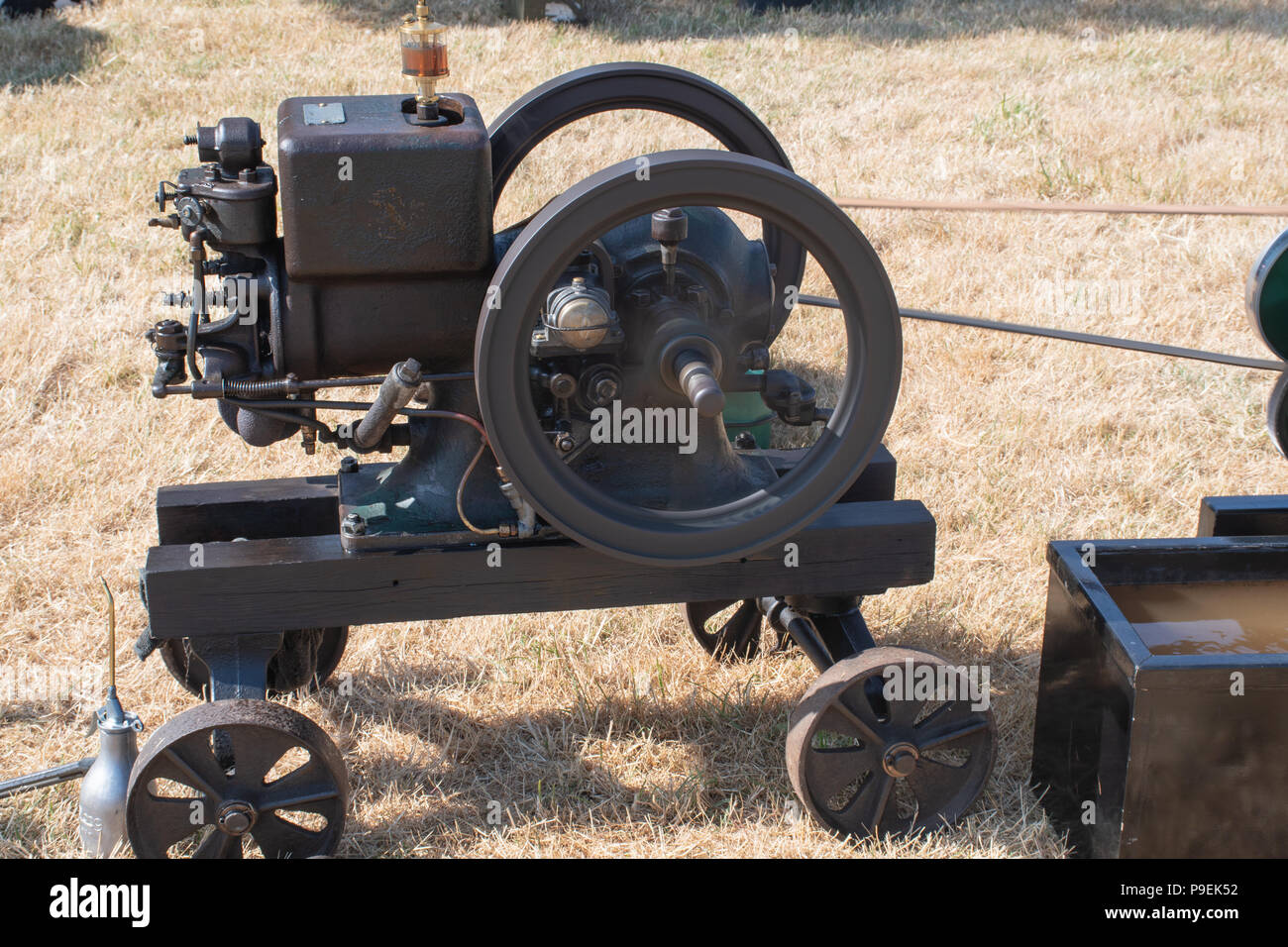 Minature steam engine with wheel Stock Photo - Alamy
