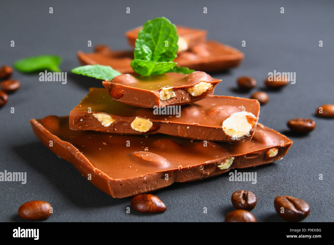 chocolate with almonds on dark grey background Stock Photo - Alamy