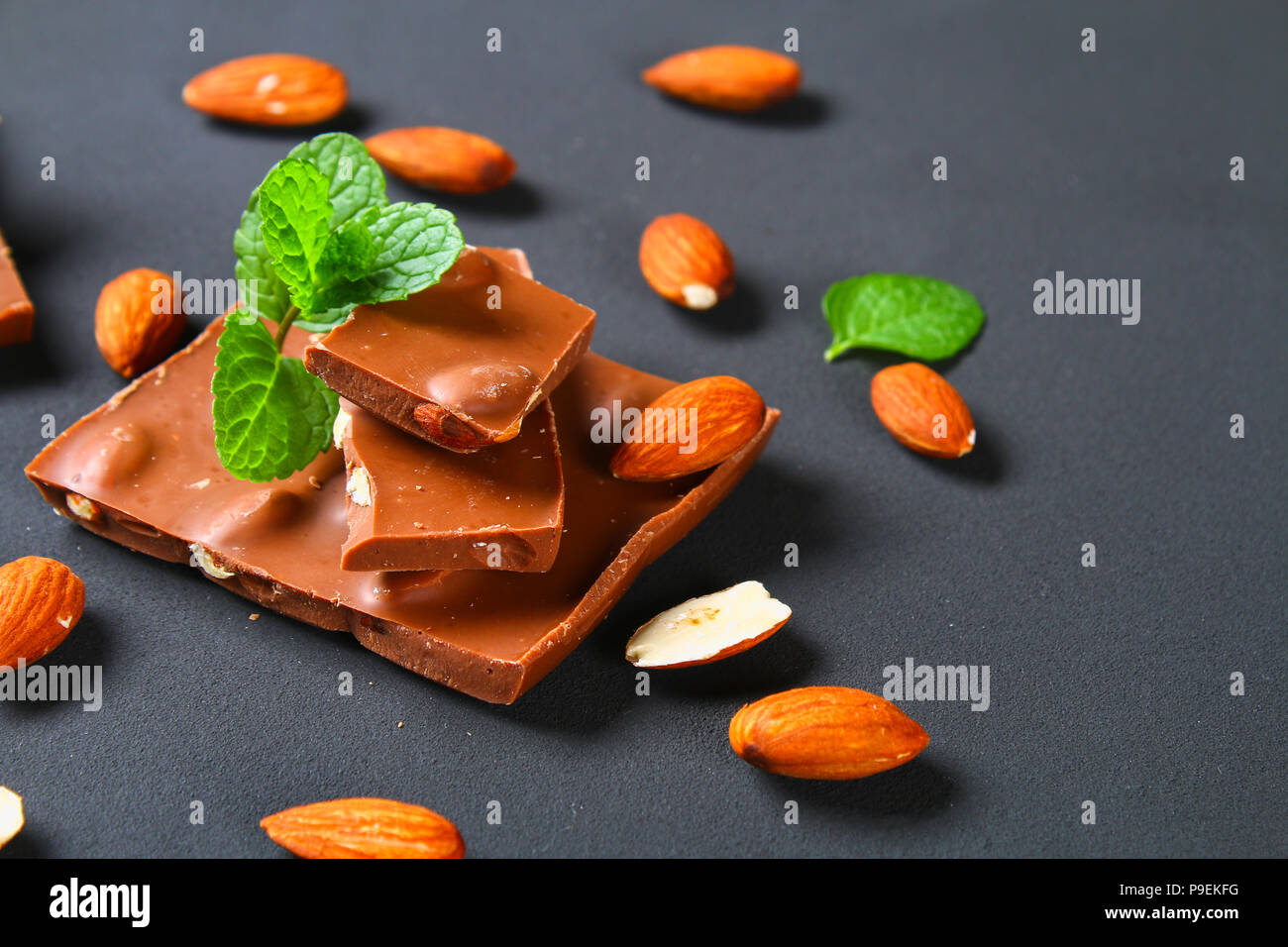 chocolate with almonds on dark grey background Stock Photo - Alamy