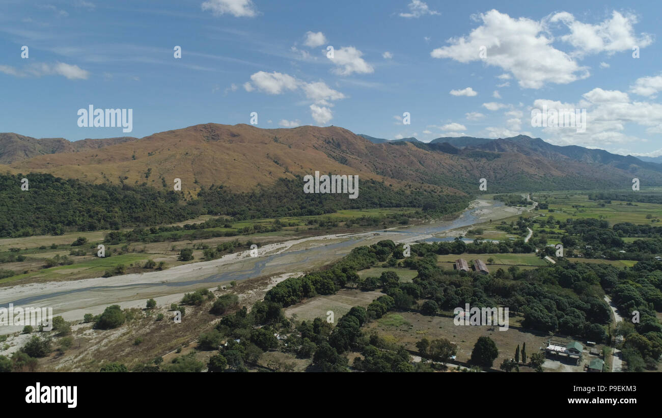 Mountain valley with village, river, farmland in the Philippines, Luzon ...