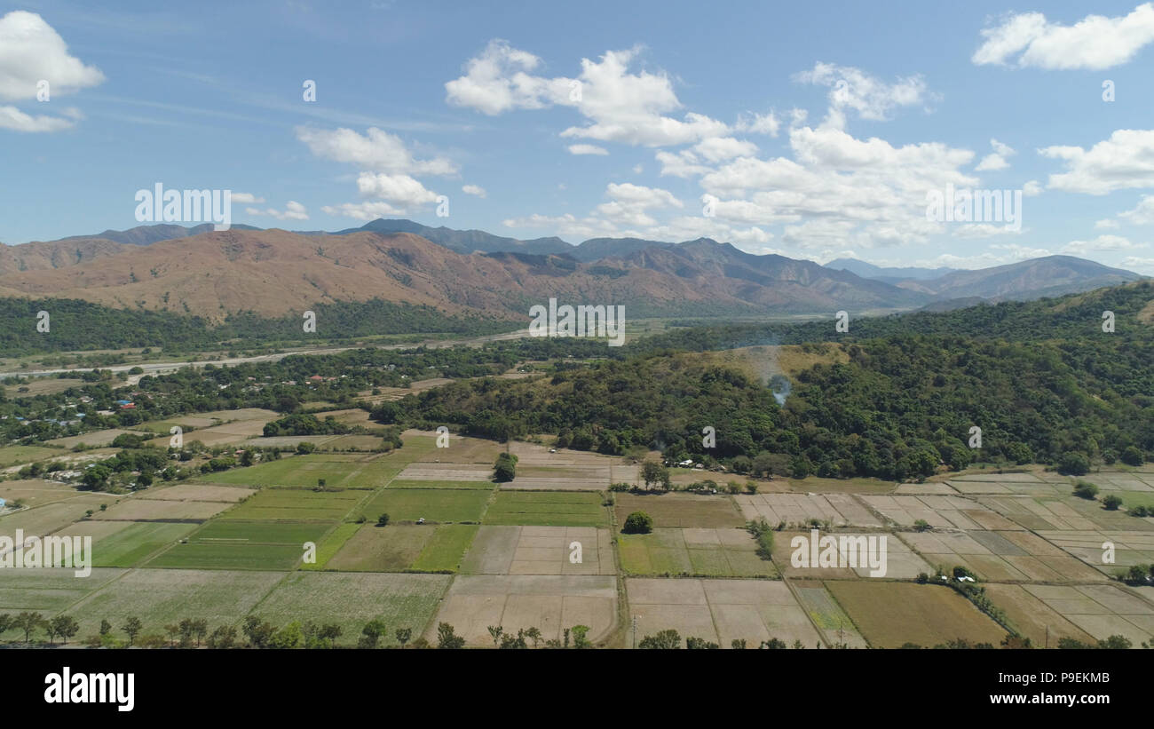 Mountain valley with village, river, farmland in the Philippines, Luzon ...