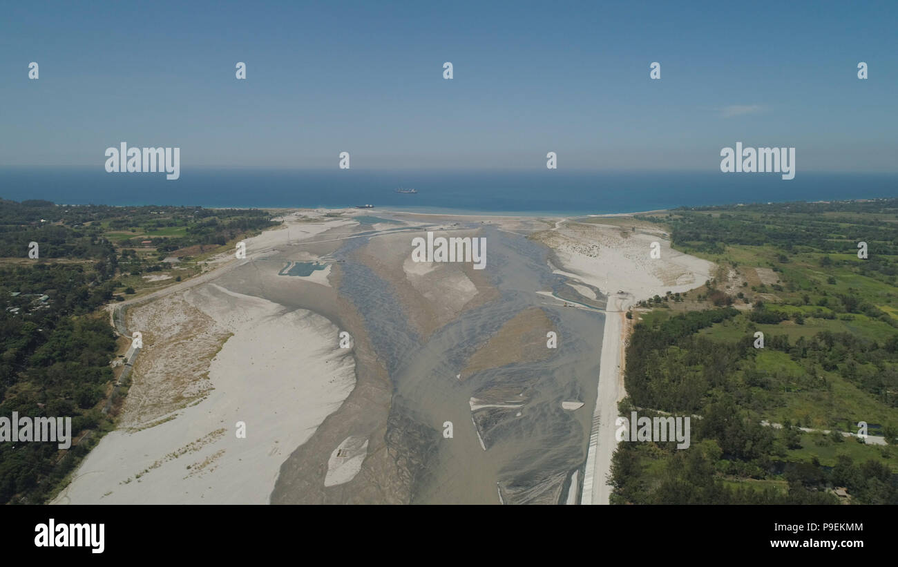 Mountain river Bucao flowing into the sea in Philippines,Luzon. Aerial ...