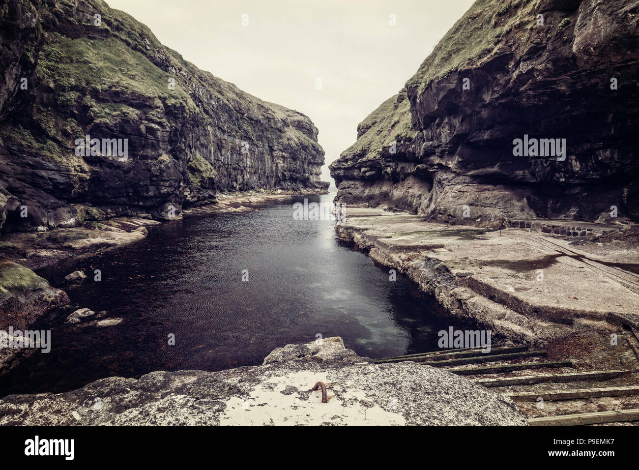 famous natural harbours in Gjogv faroe island Stock Photo - Alamy
