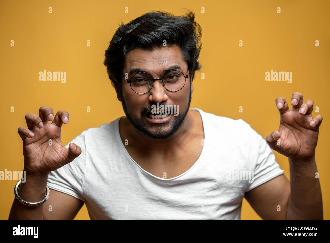 Hindoo angry guy shows attacking claws. man is ready to attack the ...