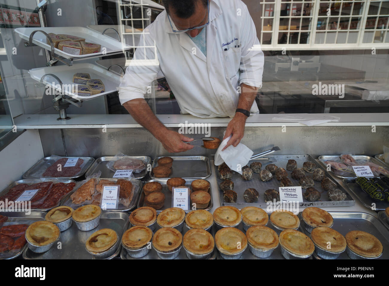 A butcher serving pies in a shop in Bath, UK. Photo date: Friday, July ...