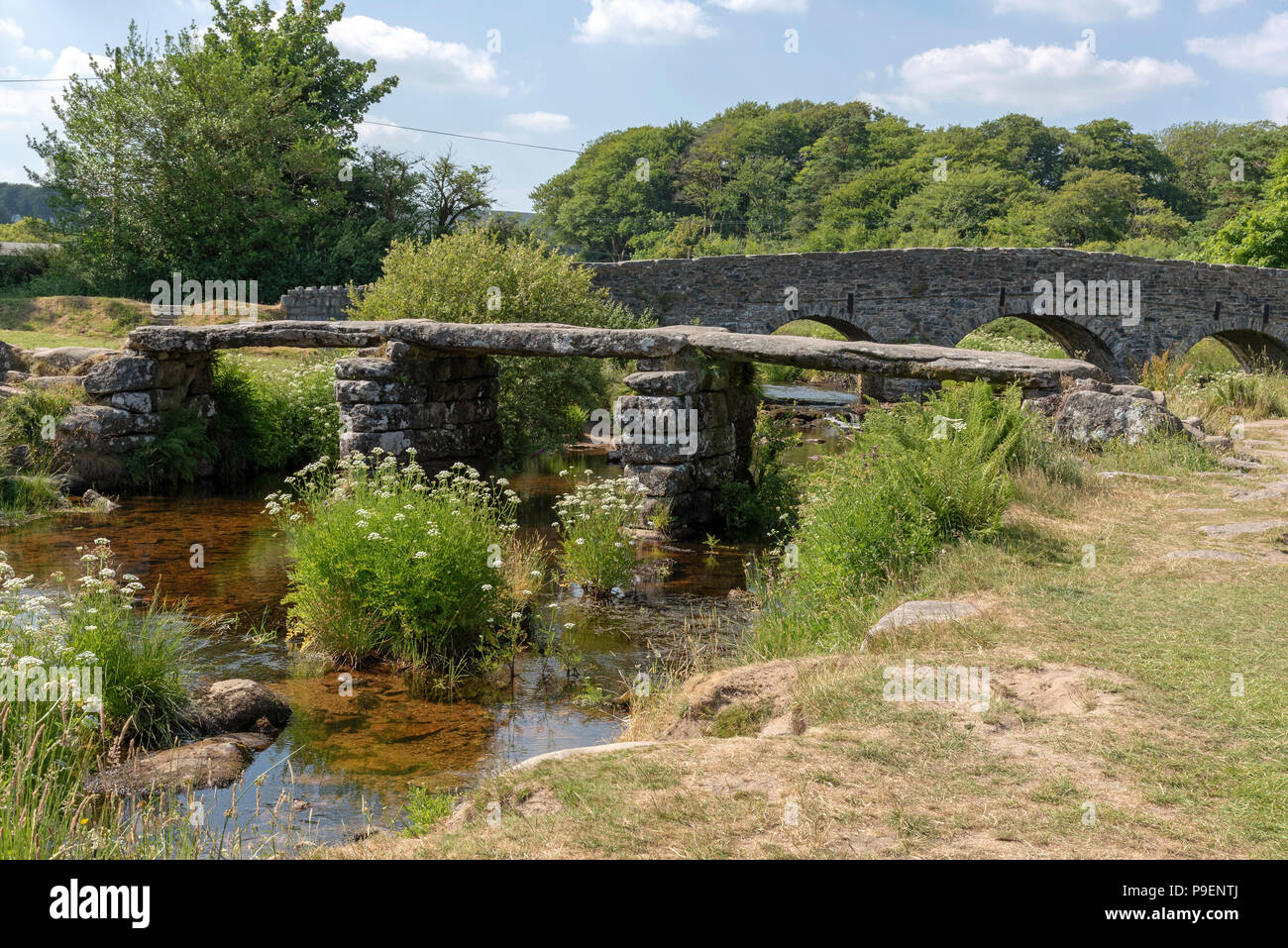 An ancient clapper bridge over the East Dart River at Postbridge ...
