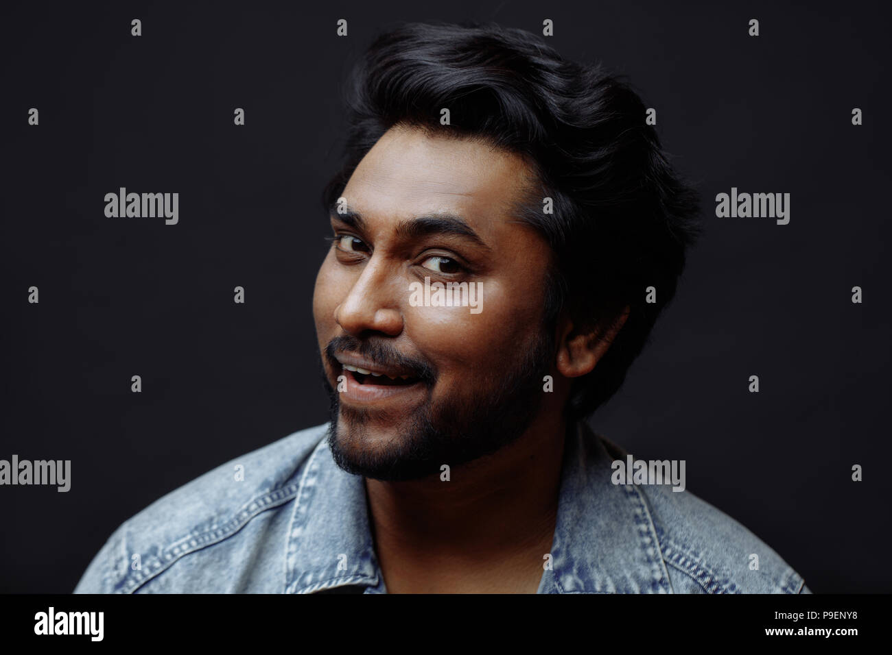 cheerful optimistic man wearing stylish outfit. coquettish look. sly as ...