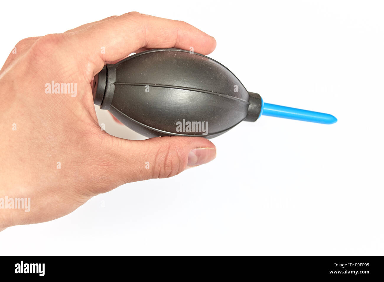 Male hand holding dust blower isolated on white background Stock Photo ...