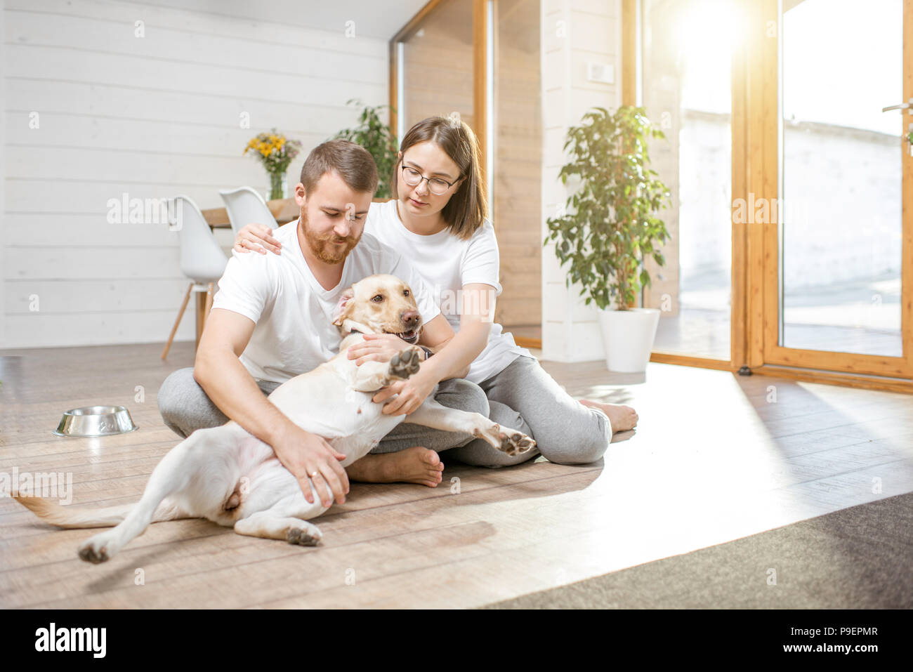 Family with dog in house hi-res stock photography and images - Alamy