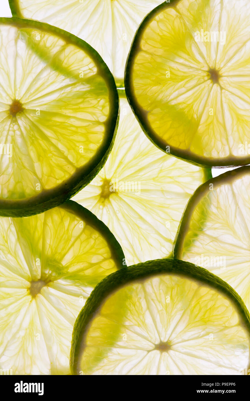 Slices of fresh lime background Stock Photo - Alamy