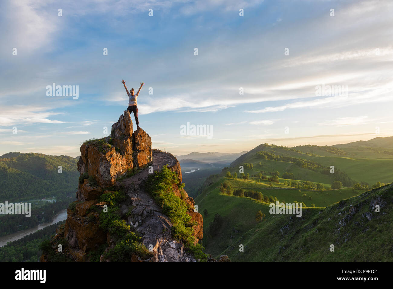 Happy woman on top mountain Stock Photo - Alamy