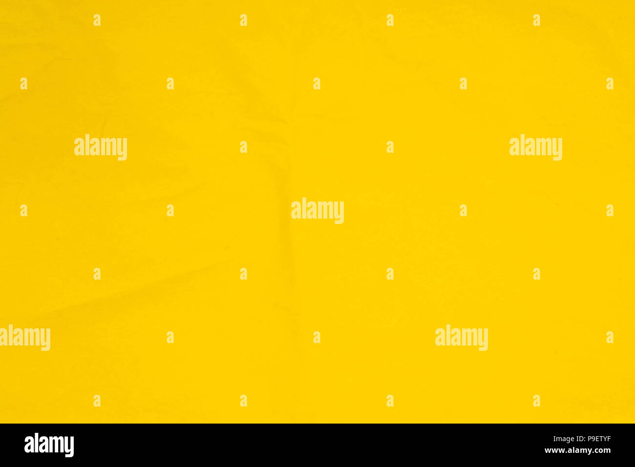 yellow color creased tissue paper background texture Stock Photo - Alamy