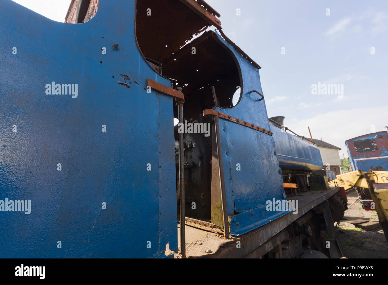 A derelict and rusting steam engine at the Cambrian Heritage Railway ...