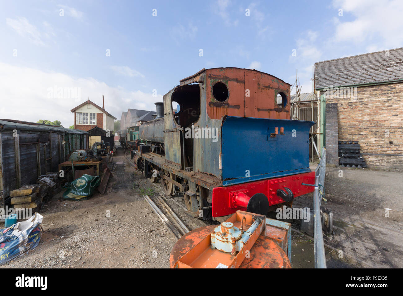 A derelict and rusting steam engine at the Cambrian Heritage Railway ...