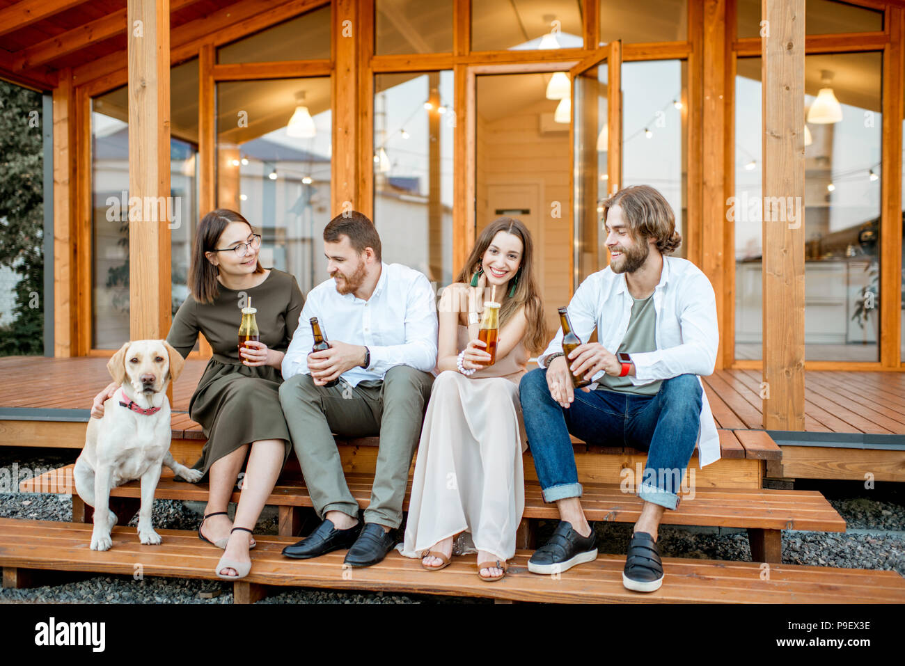 Four happy friends home party hi-res stock photography and images - Alamy