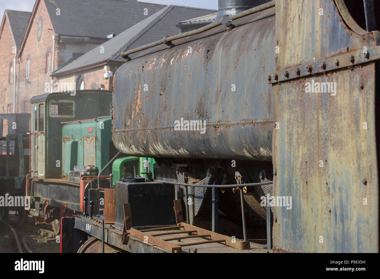 A derelict and rusting steam engine at the Cambrian Heritage Railway ...