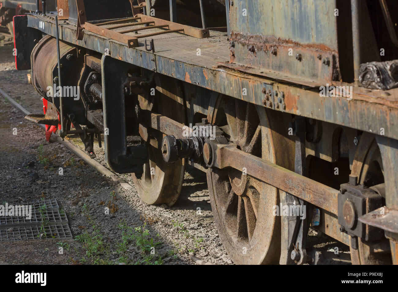A derelict and rusting steam engine at the Cambrian Heritage Railway ...