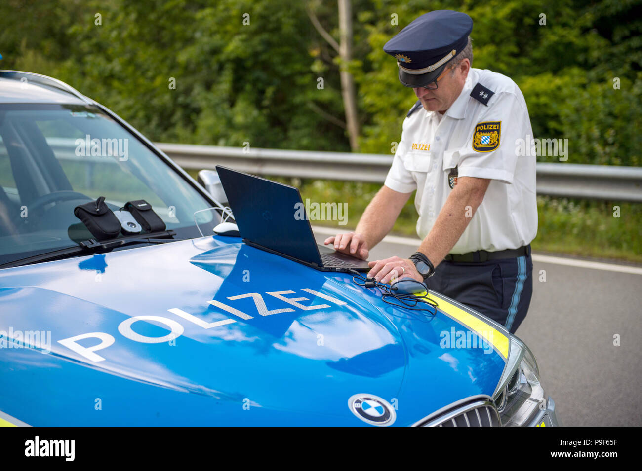 Kirchdorf, Germany. 18th July, 2018. An officer of the Bavarian border ...