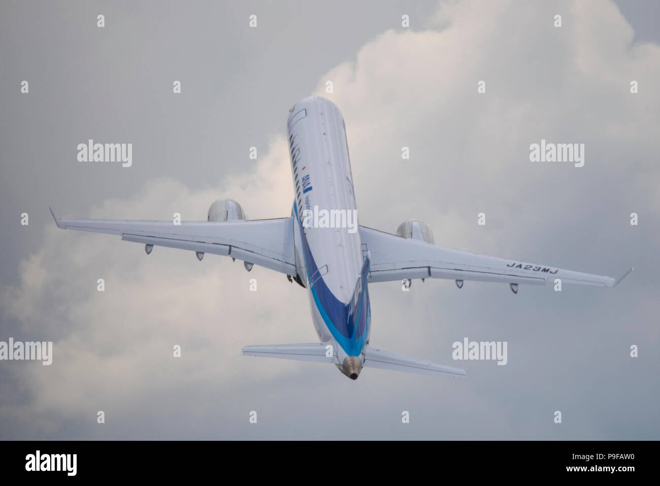 Mitsubishi MRJ90 airliner jet plane flying at the Farnborough ...