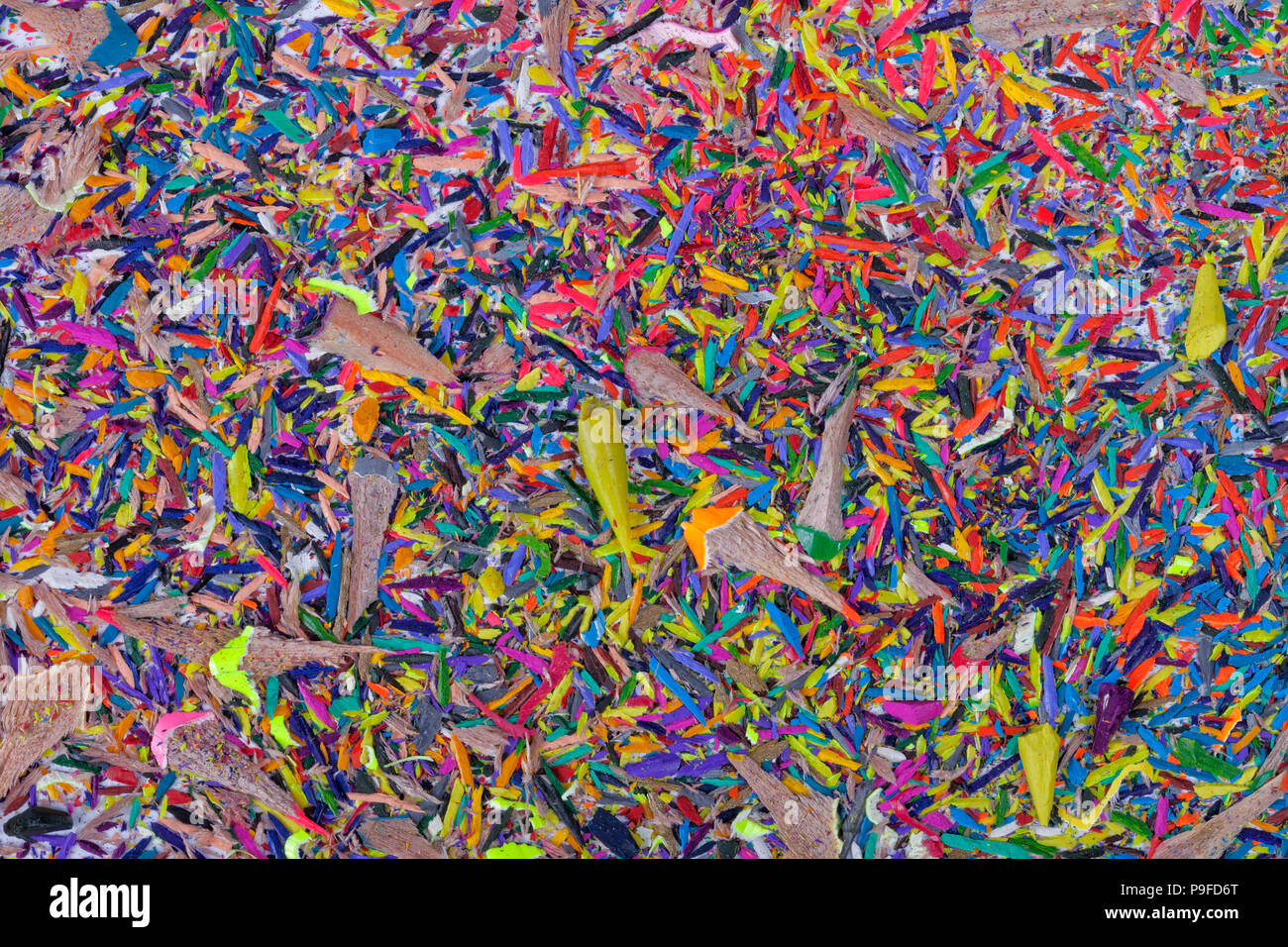 The remains of sharpening colored wax pencils background Stock Photo ...