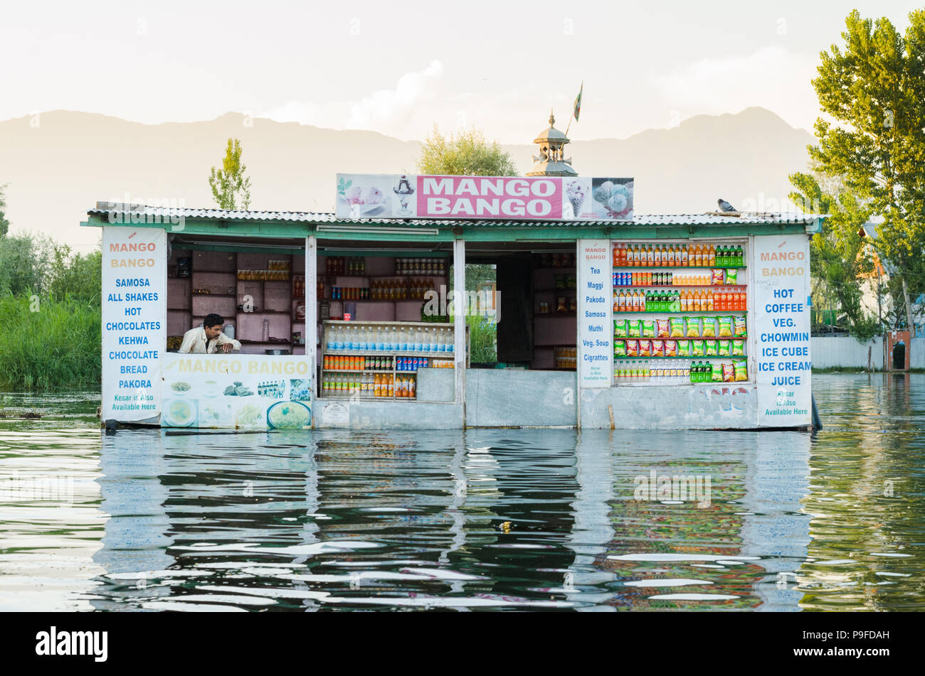 Floating convenience shop selling packed food items in the middle of ...