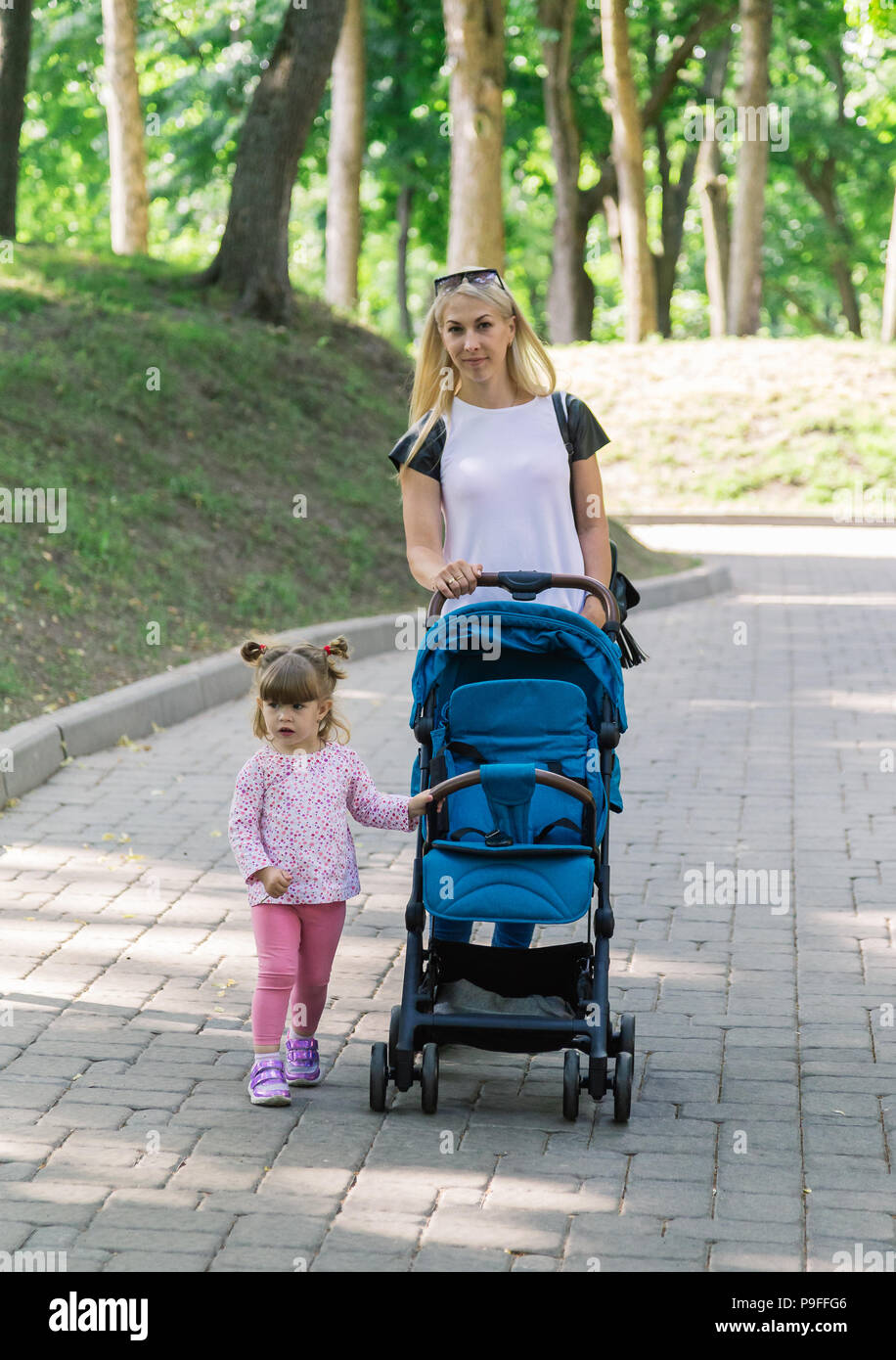 Couple And Pushing Pram And Park High Resolution Stock Photography and ...