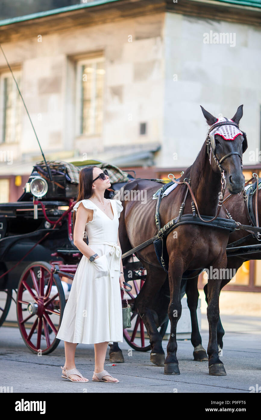 Tourist girl enjoying a stroll through Vienna and looking at the ...