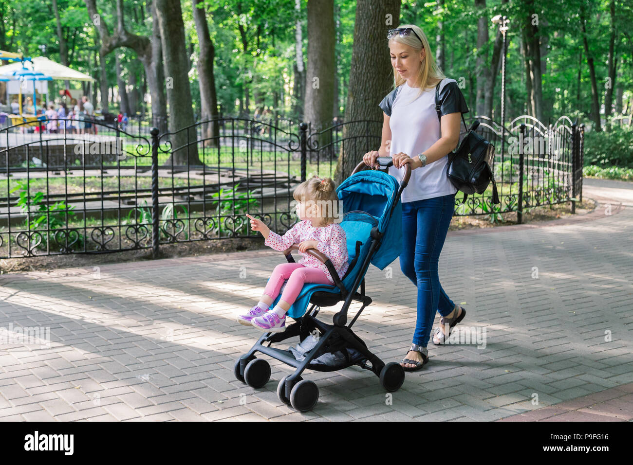 Couple And Pushing Pram And Park High Resolution Stock Photography and ...