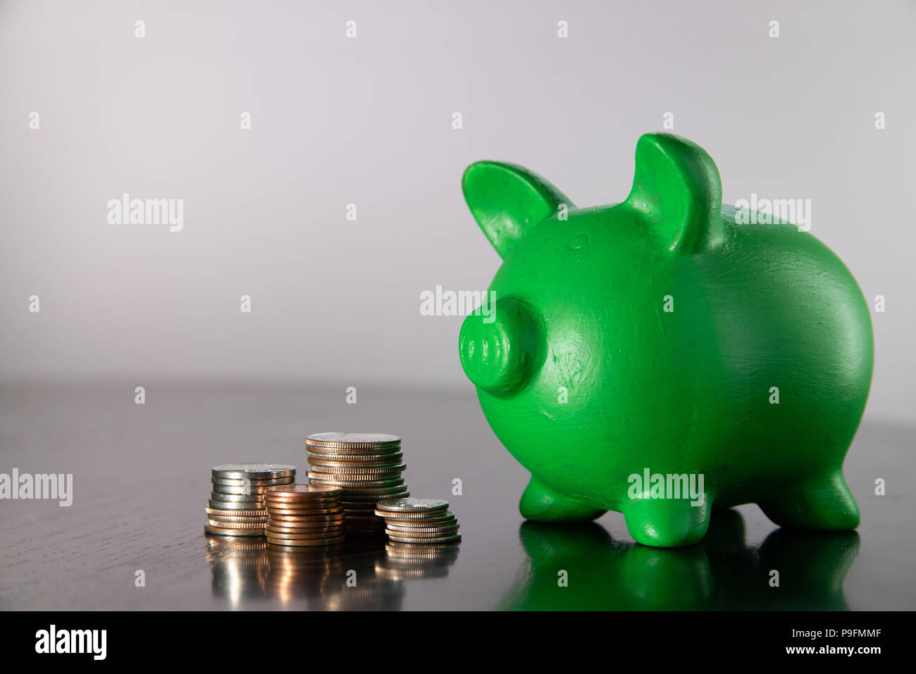 Green coin bank hi-res stock photography and images - Alamy