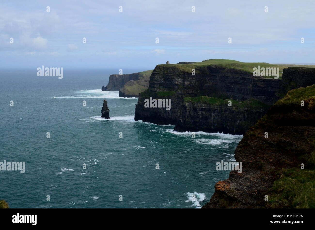 Deep blue waters crashing into the Cliffs of Moher Stock Photo - Alamy