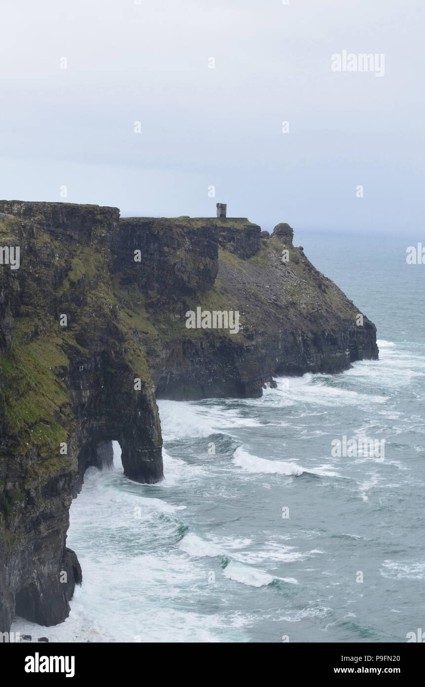 The beautiful cliffs of moher with crashing ocean waves Stock Photo - Alamy