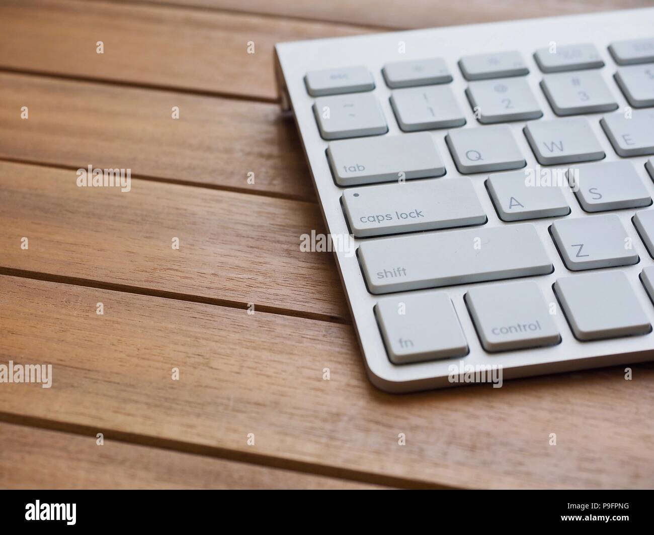 Wooden board with white keyboard Stock Photo - Alamy
